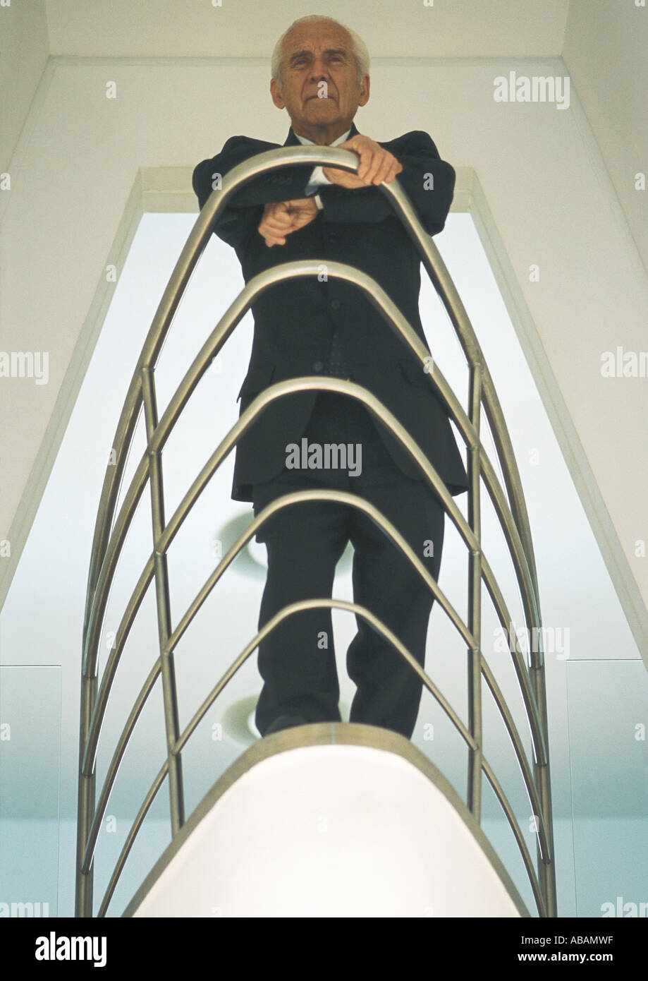 Old man leaning railings hi-res stock photography and images - Alamy