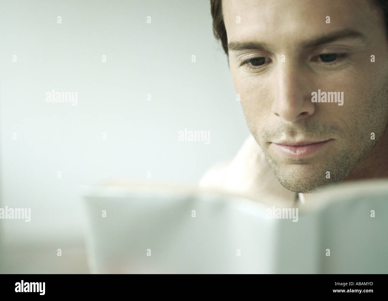 Man reading book Stock Photo - Alamy
