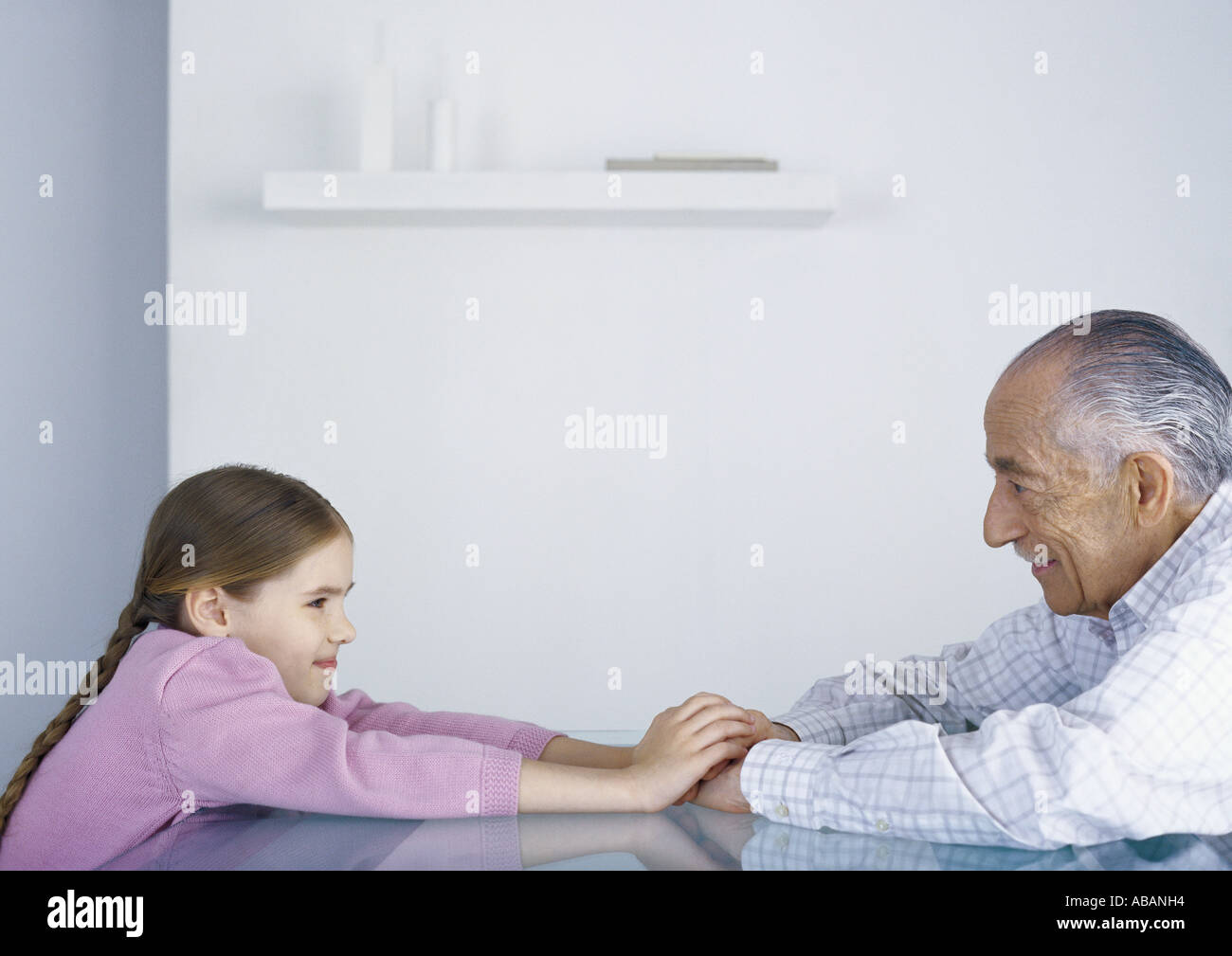 Holding hands across table hi-res stock photography and images - Alamy