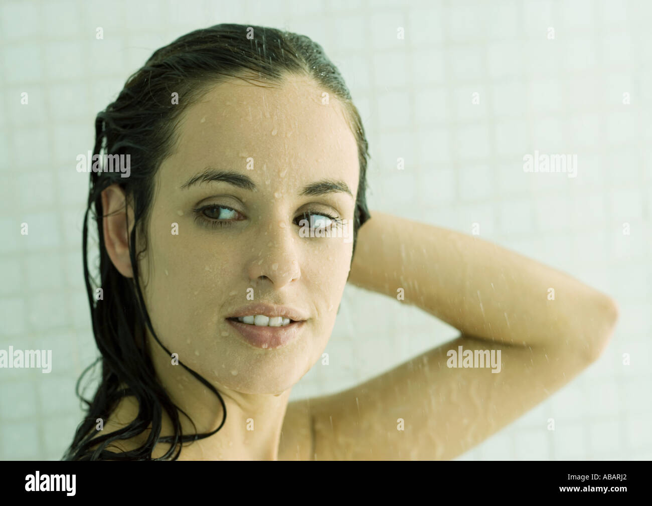 Woman taking shower Stock Photo - Alamy