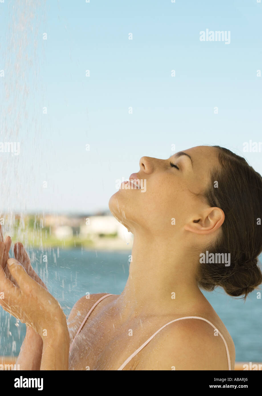 Woman showering outside hi-res stock photography and images - Alamy