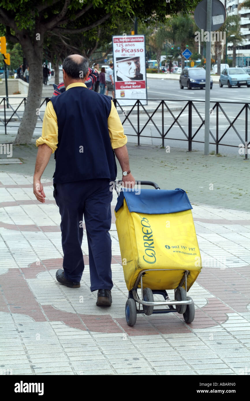 Spanish postman wheels his trolley containing the mail. Malaga southern ...