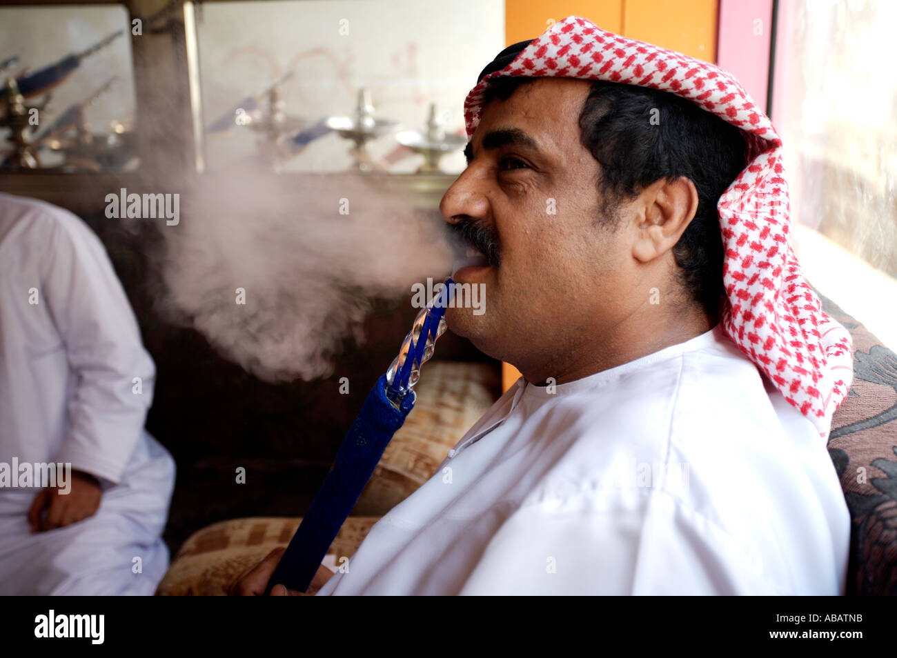 Young Saudi Arabian Man Smoking Arabic Hubble Bubble Hookah, 60% OFF