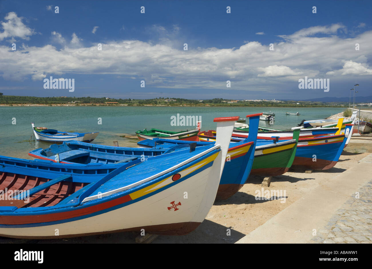 Portugal, the Algarve, Alvor, painted fishing boats on the harbour ...