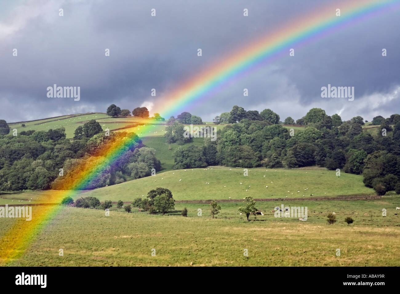 A Rainbow over typical English countryside Stock Photo - Alamy