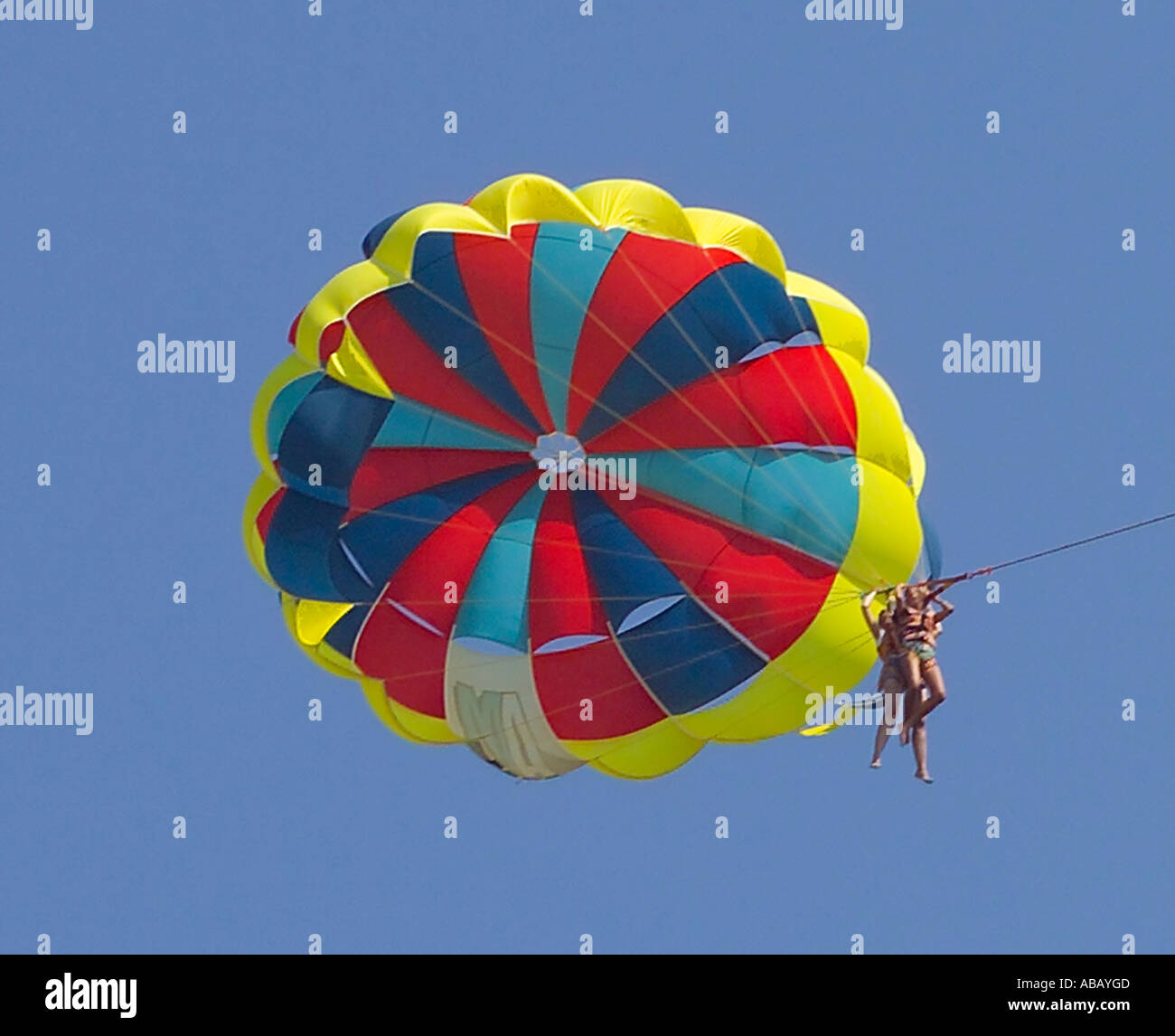 Sunny Breach, Couple Parascending Stock Photo - Alamy