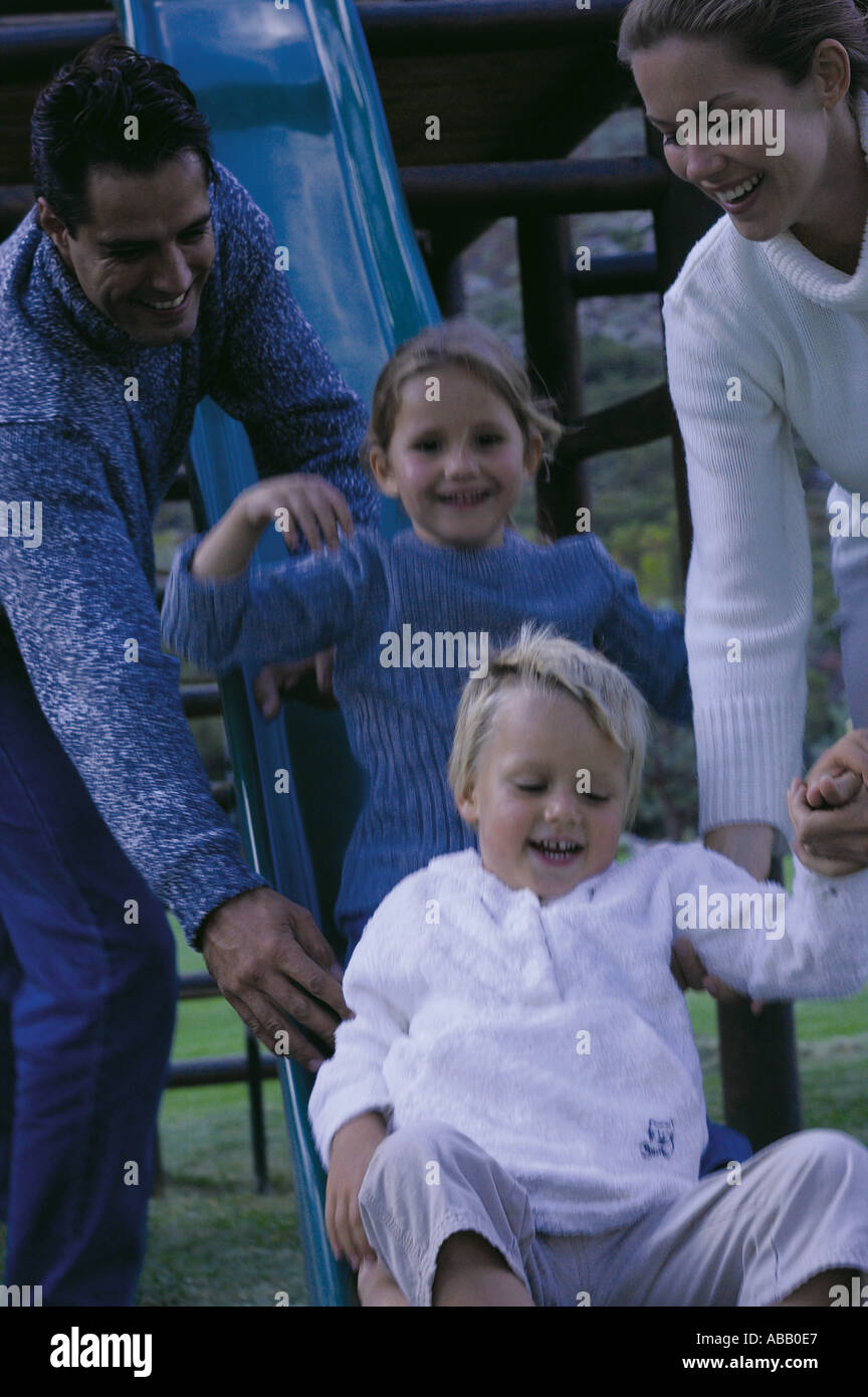 Family in playground Stock Photo - Alamy