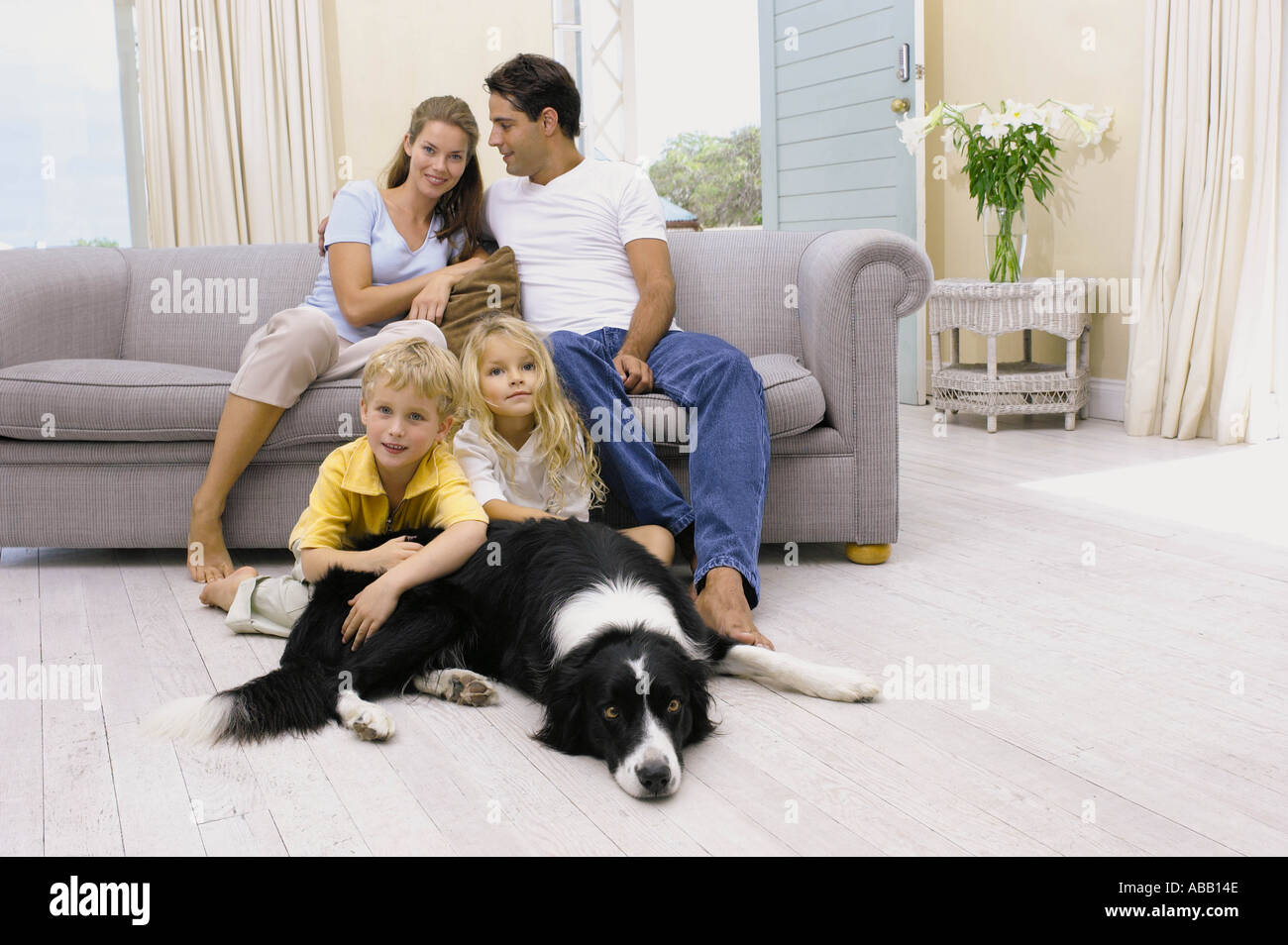 Family at home Stock Photo - Alamy