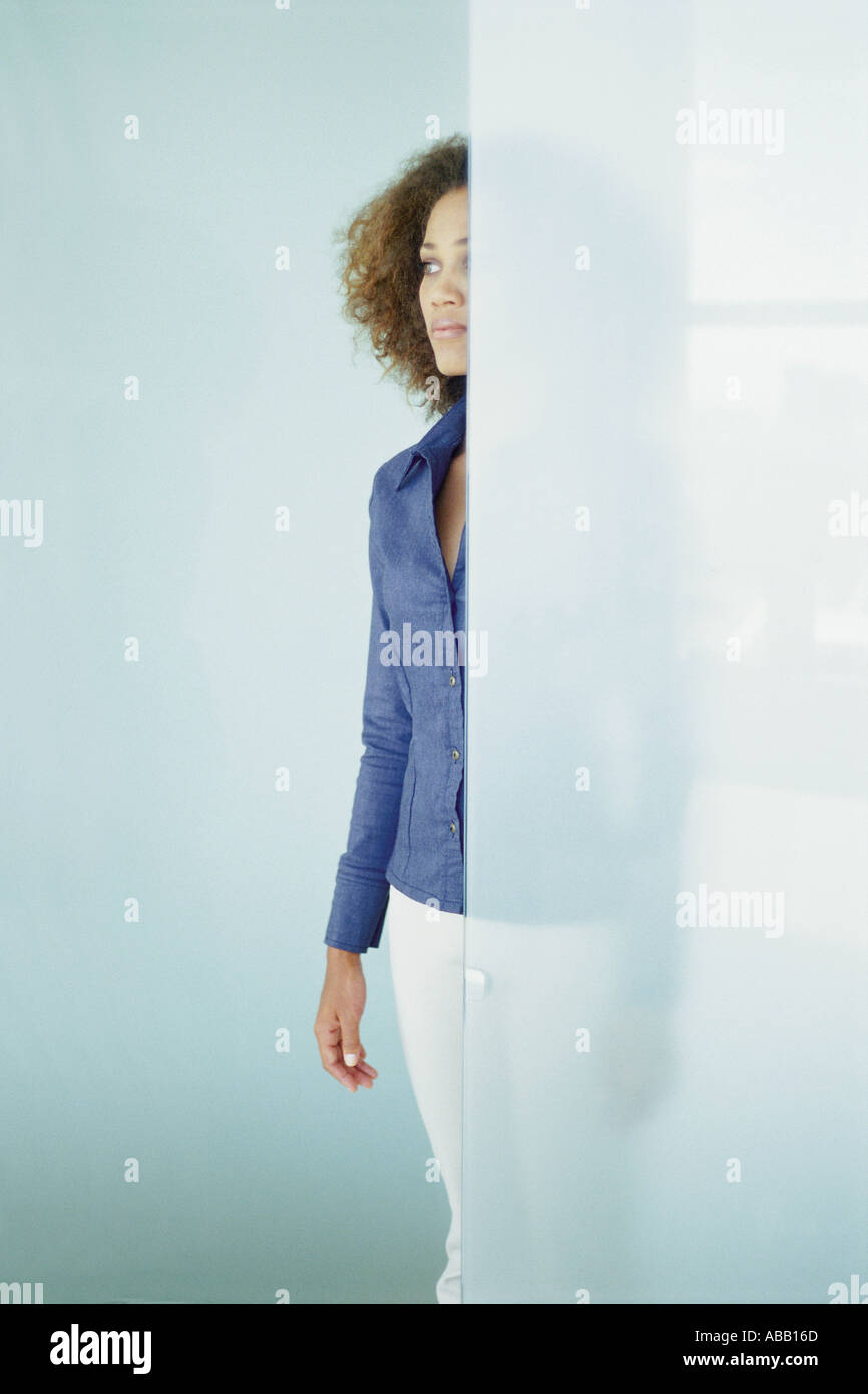 Businesswoman behind a door Stock Photo - Alamy