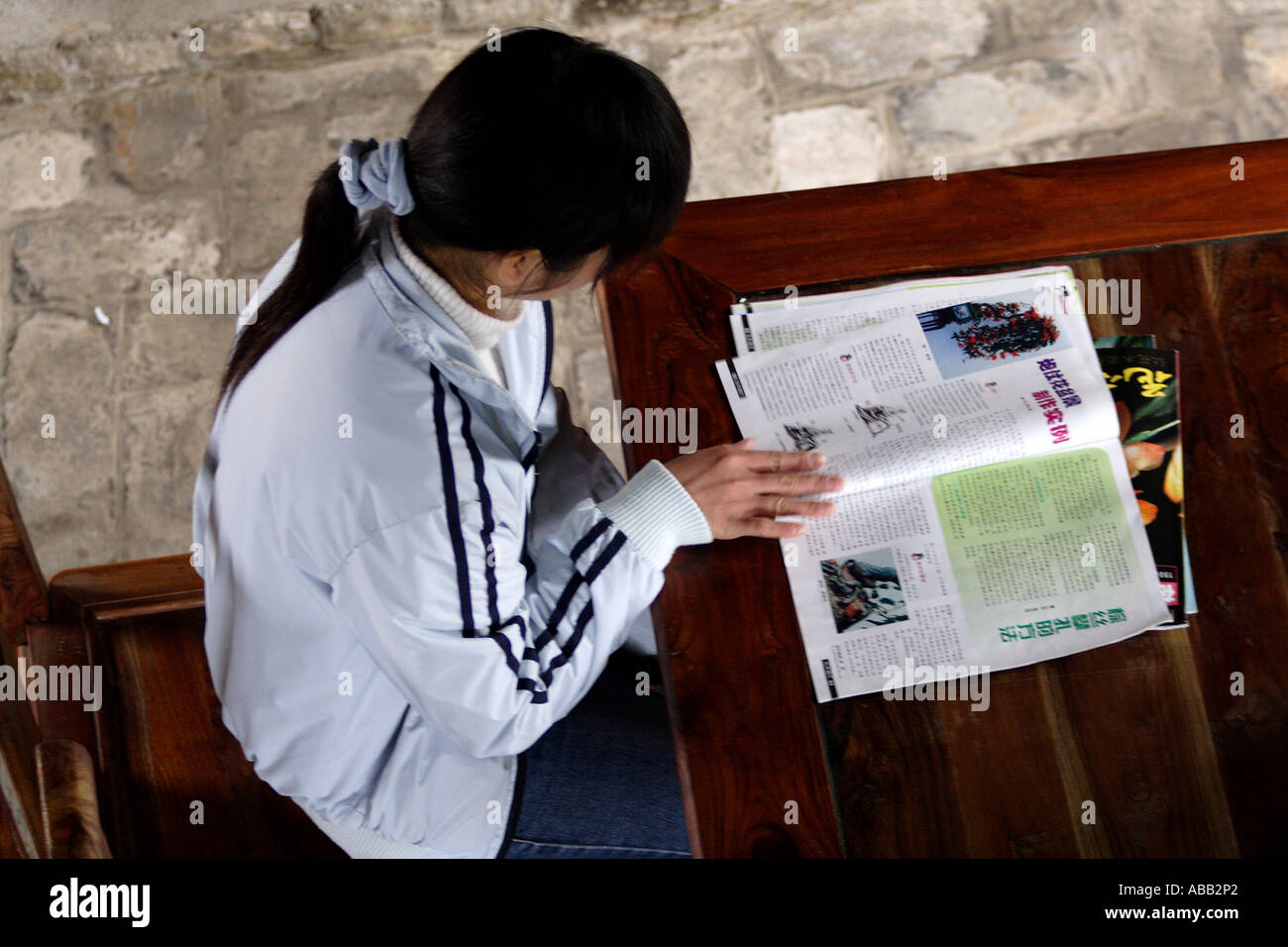 Young Asian Woman Reading a Magazine, Liugong Village, Yangshuo, China ...