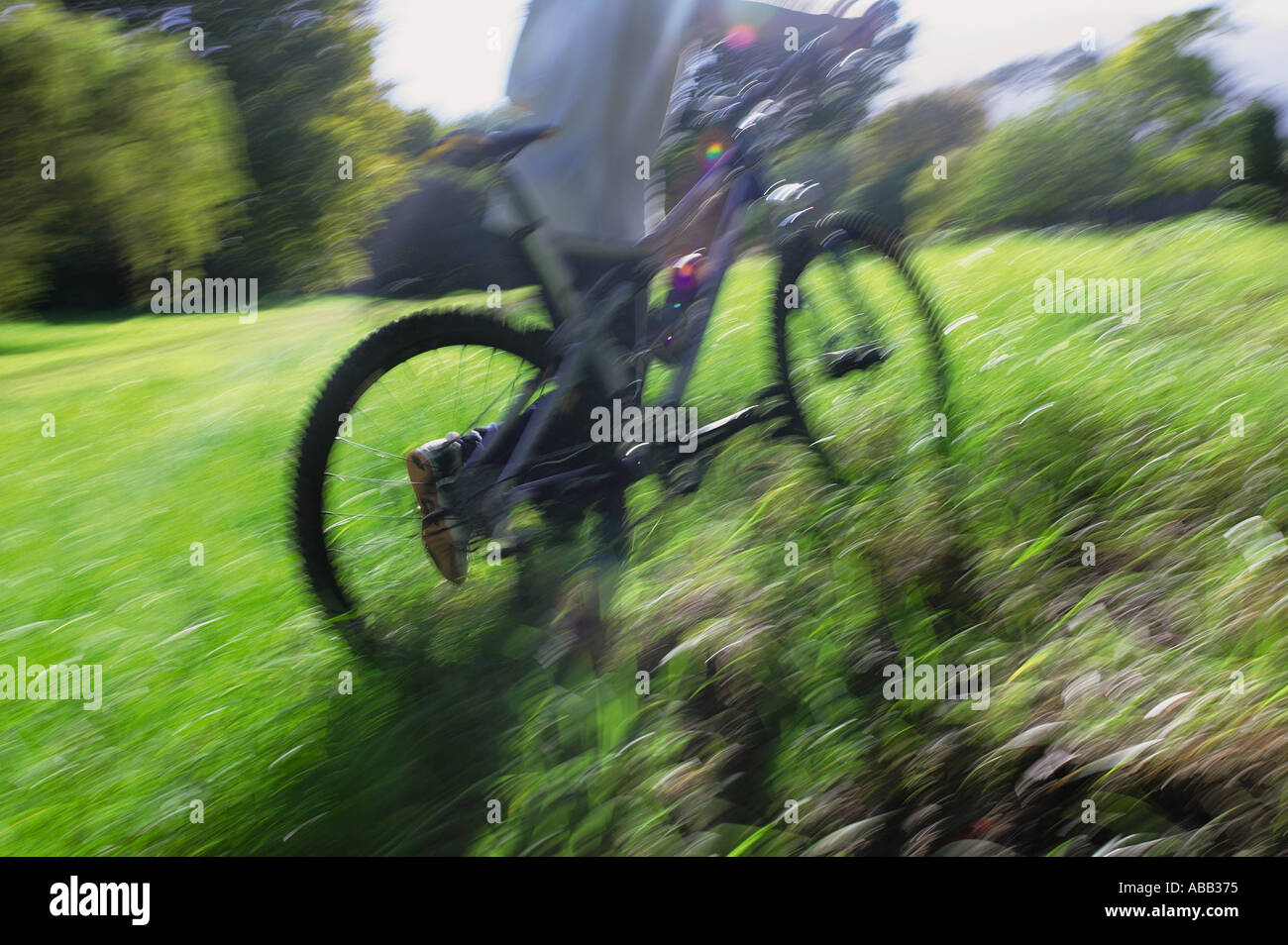 Man pushing bike Stock Photo - Alamy