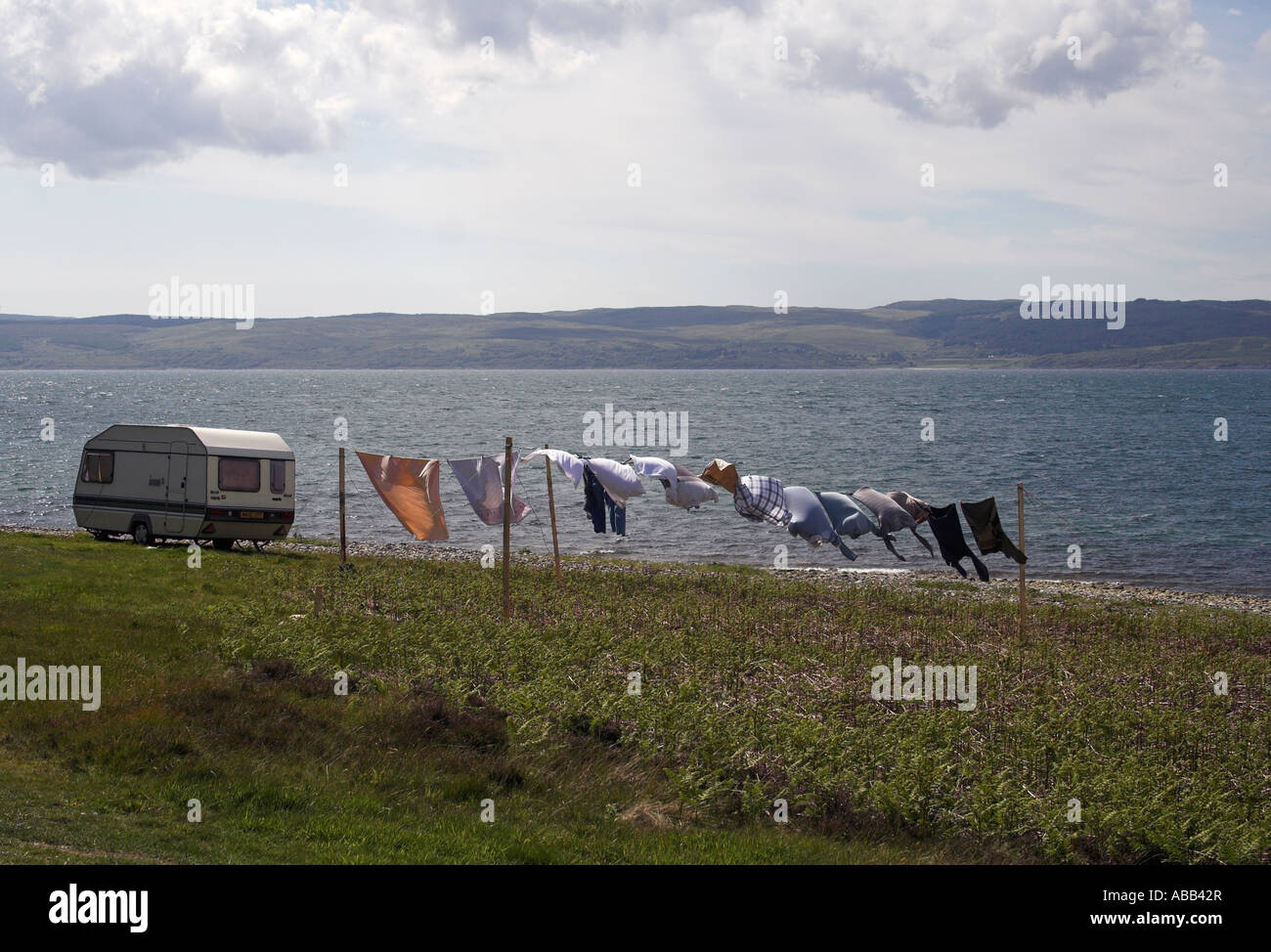 Clothes drying on a line next to a caravan, Arran, West Coast of ...