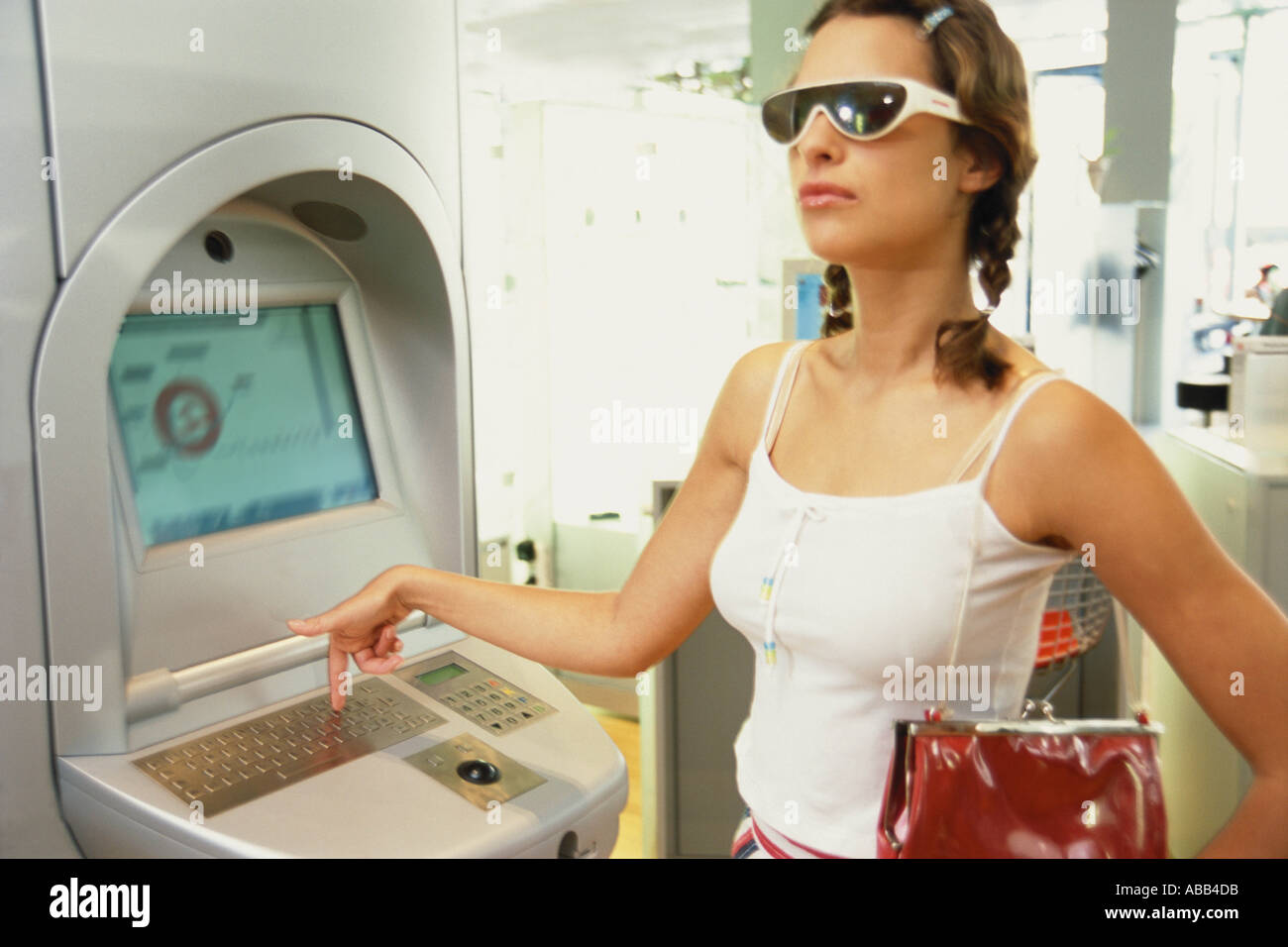 Girl at internet terminal Stock Photo - Alamy