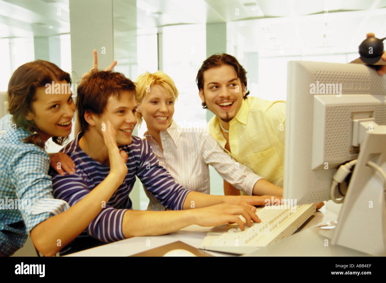 Friends at computer Stock Photo - Alamy