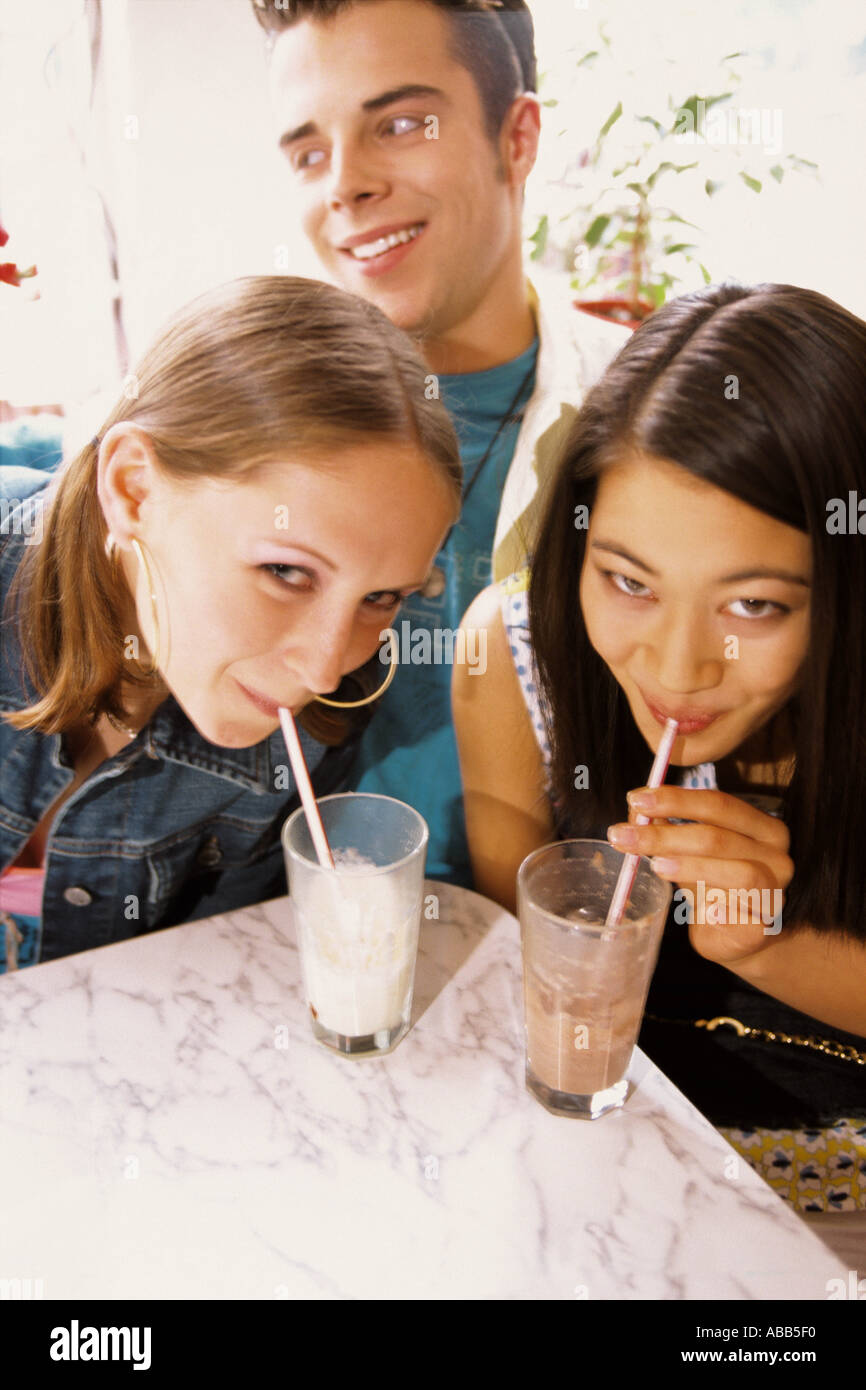 Friends drinking milkshakes Stock Photo - Alamy