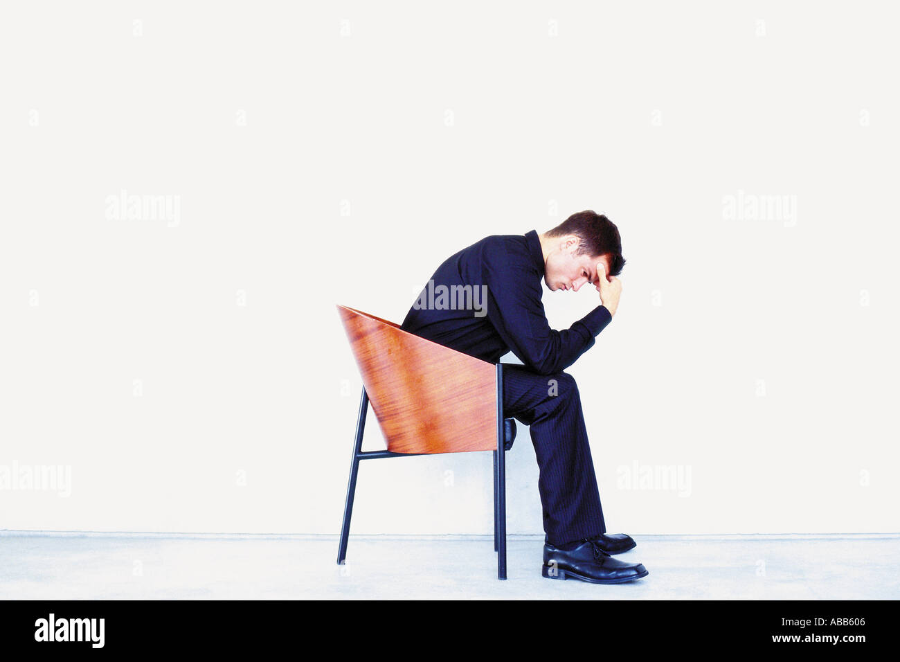 Man thinking in chair Stock Photo - Alamy
