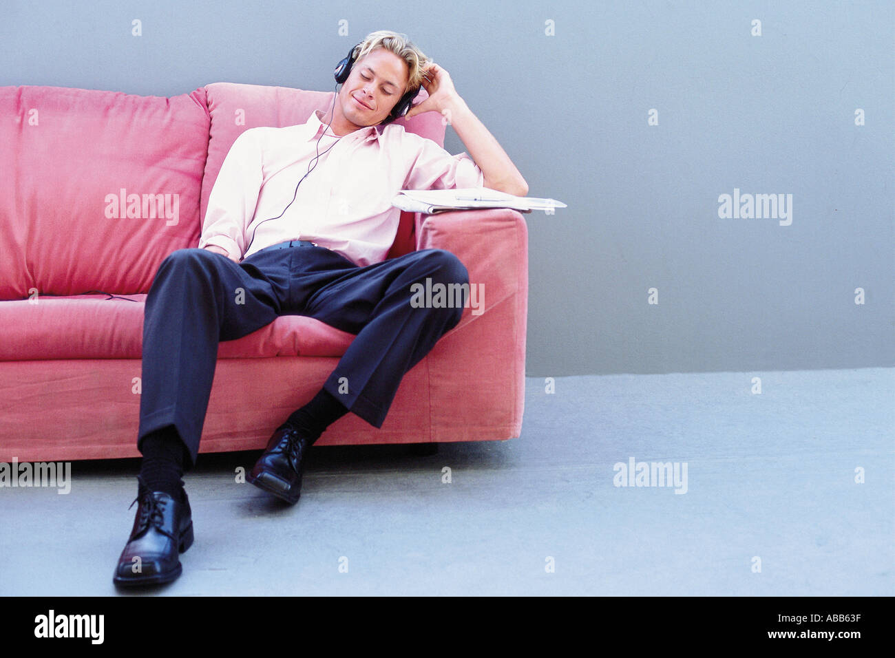 Man resting listening music hi-res stock photography and images - Alamy