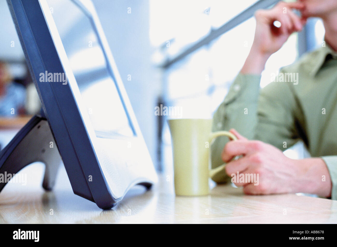 Computer and mug Stock Photo - Alamy