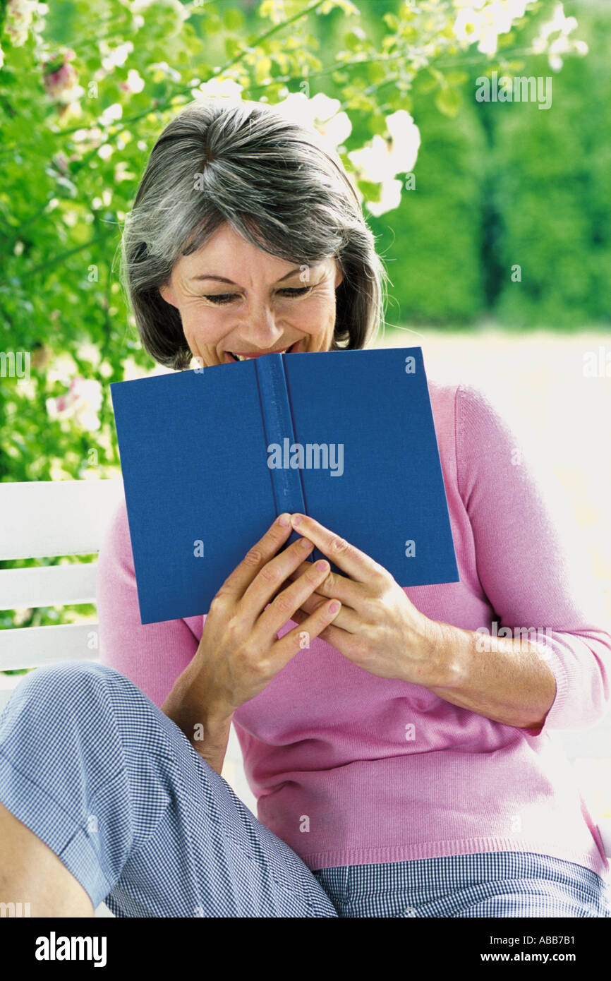 Older Woman Reading Book High Resolution Stock Photography and Images ...
