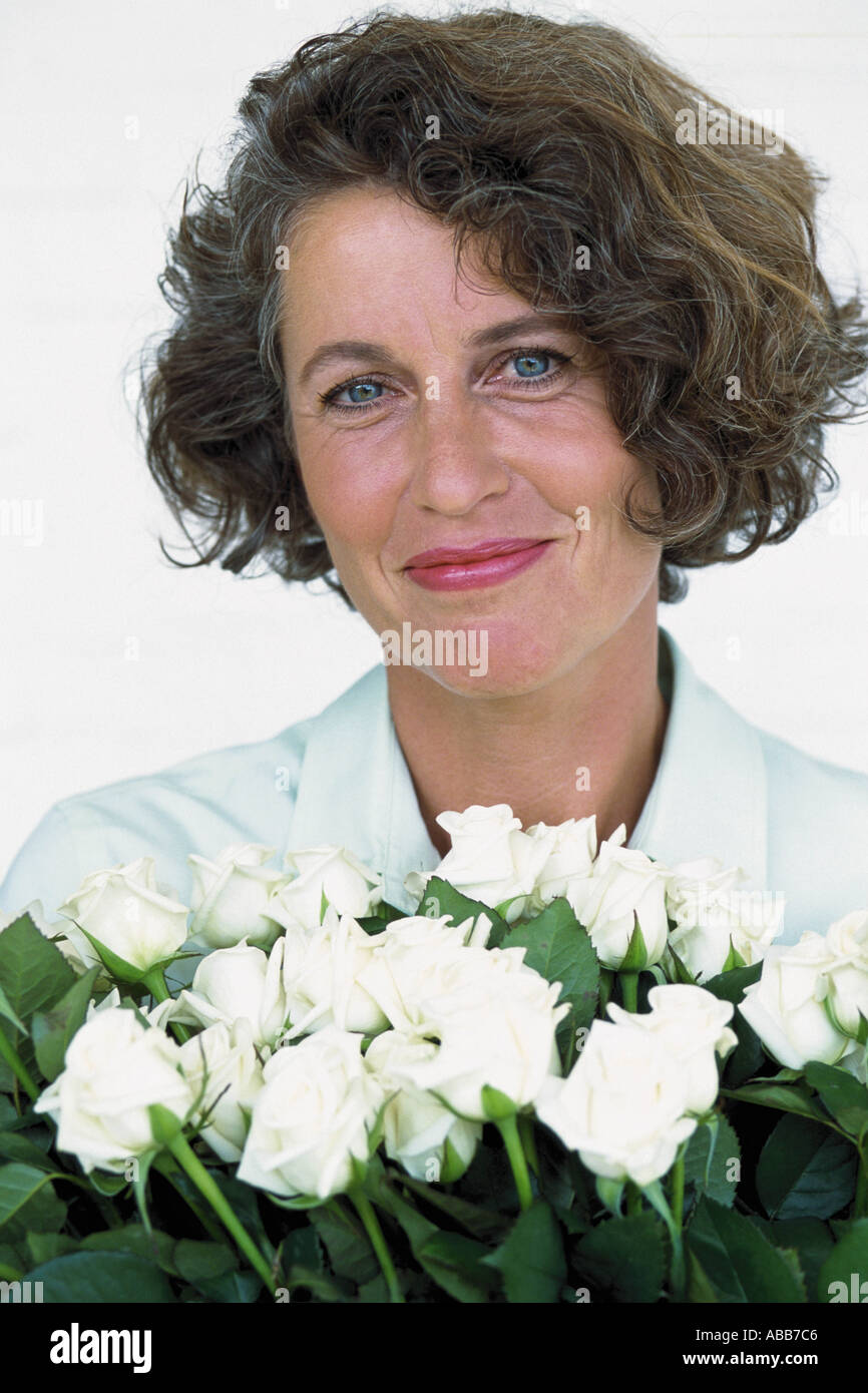 Woman with roses hi-res stock photography and images - Alamy