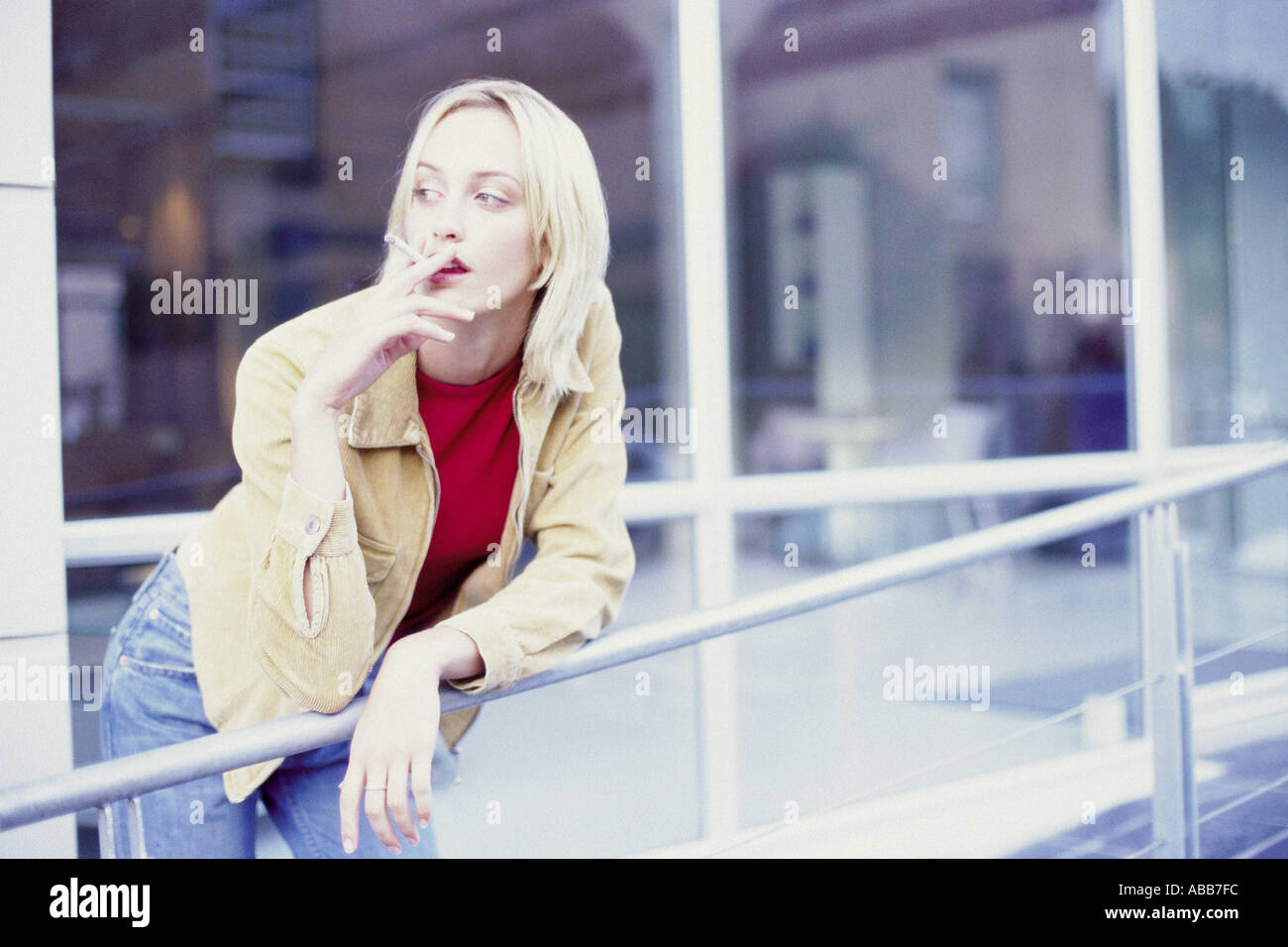 Smoking on a balcony hi-res stock photography and images - Alamy