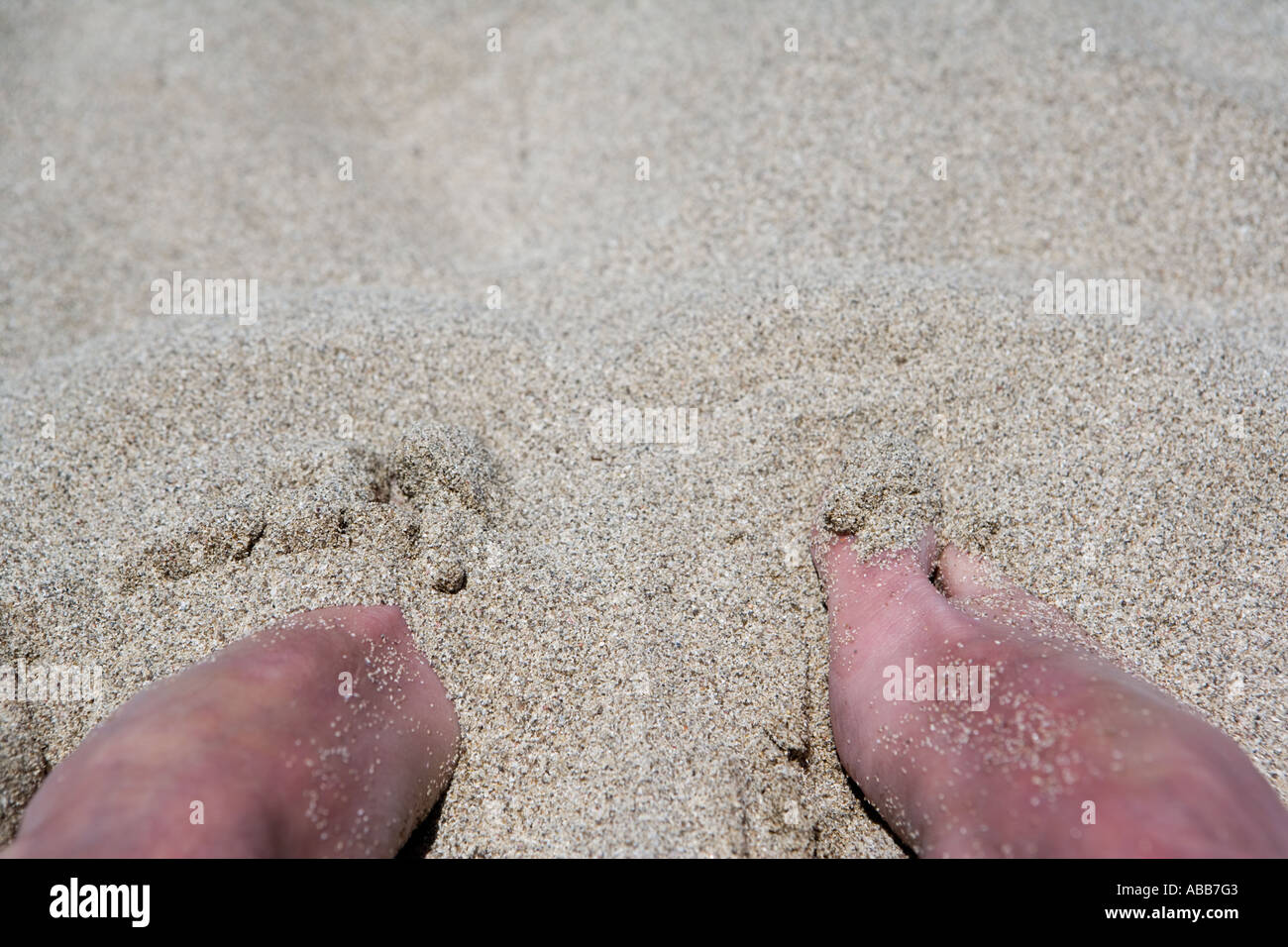 FEET IN SAND Stock Photo - Alamy