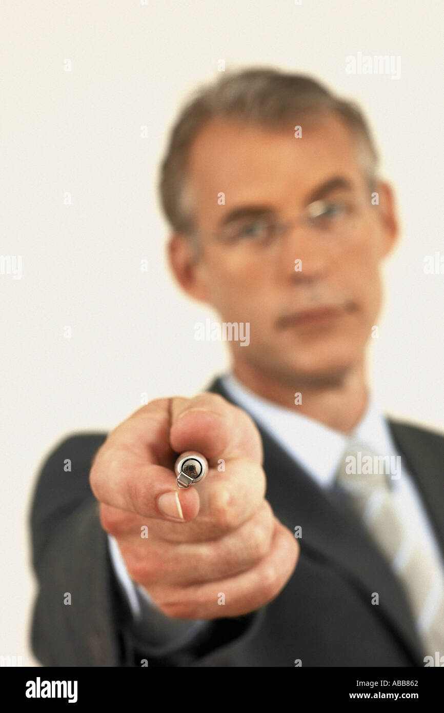 Businessman pointing pen Stock Photo - Alamy