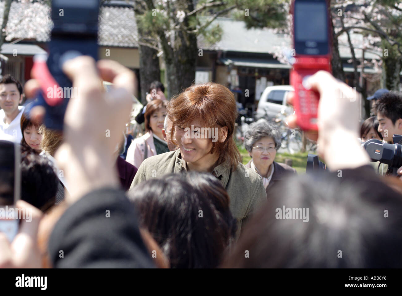 Famous Japanese Personality Being Photographed During a Public ...