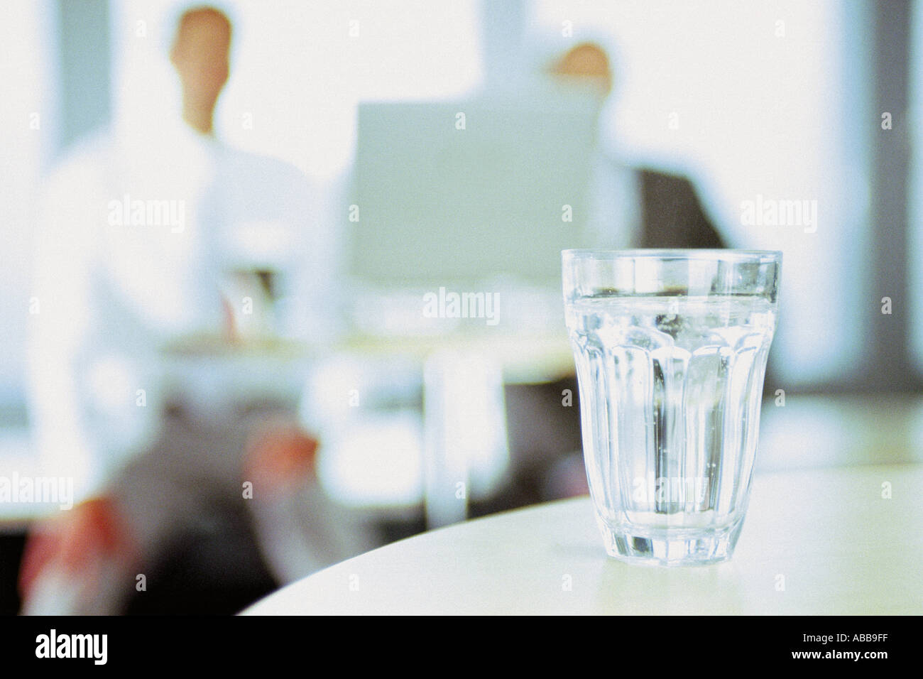 Glass of water in office Stock Photo - Alamy