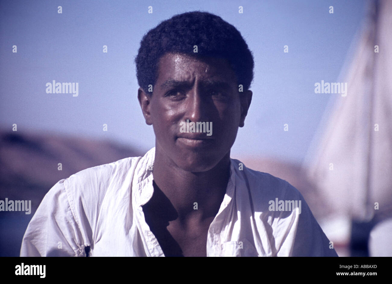 arabian man on a boat on river nile egypt in 1960s old faded slide ...