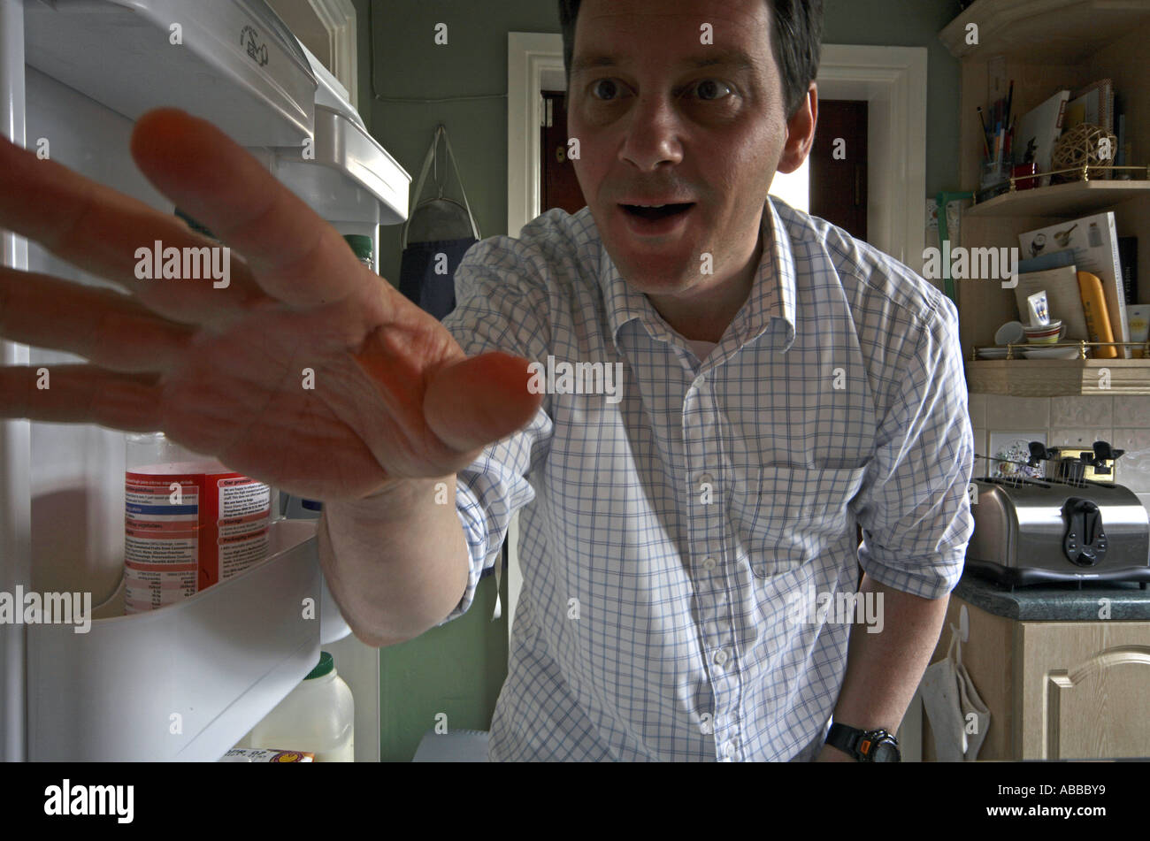 Conceptual image showing white caucasian man reaching for something in ...