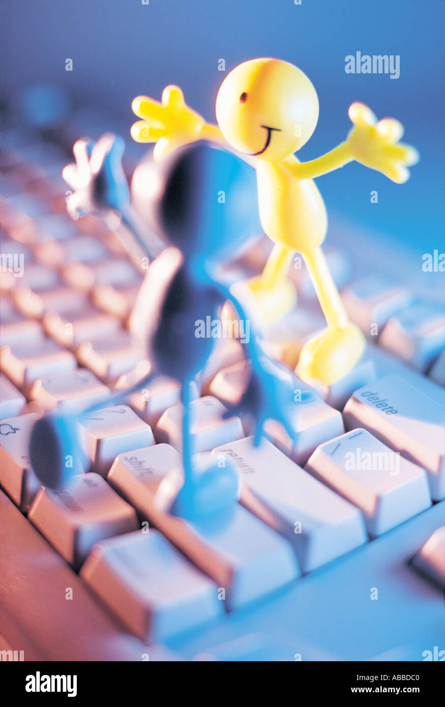 Rubber Figures on Computer Keyboard Stock Photo - Alamy