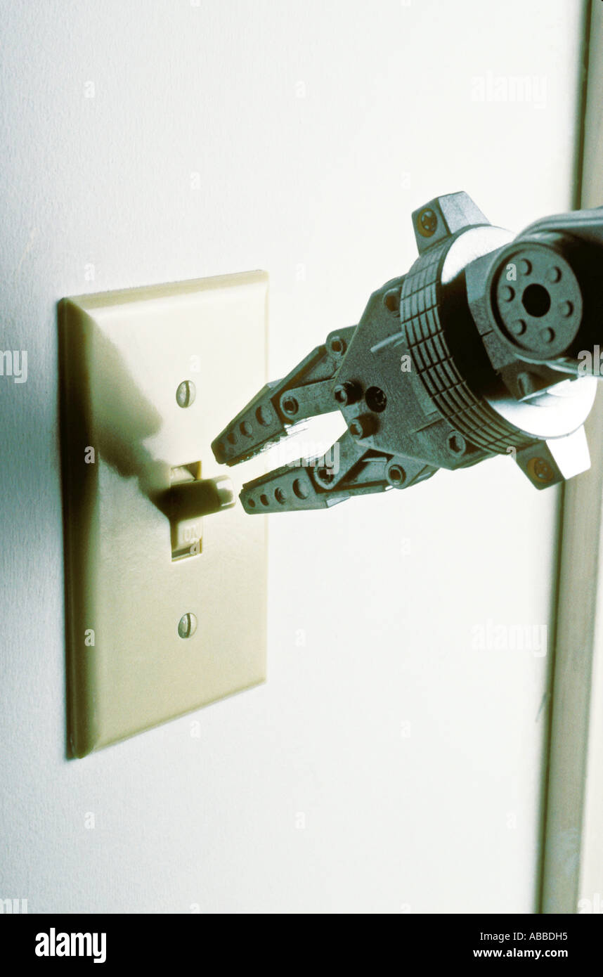 Robot turning off light switch Stock Photo - Alamy