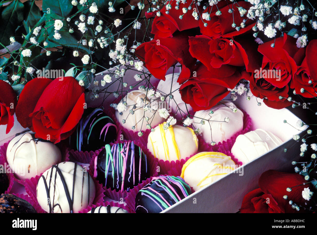 Box of candy with red roses Stock Photo - Alamy