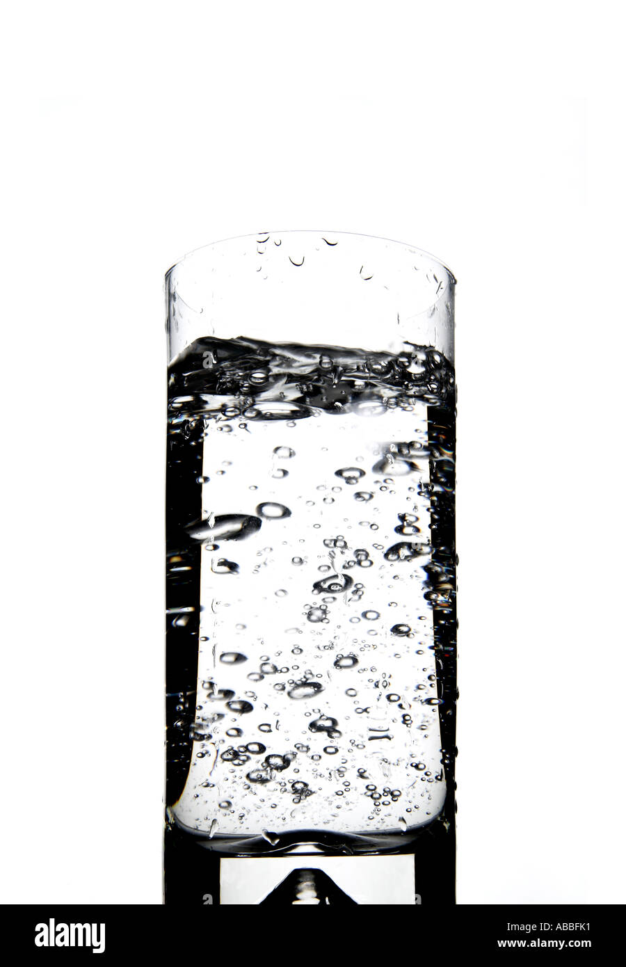 Glass of sparkling bubbling water Stock Photo - Alamy