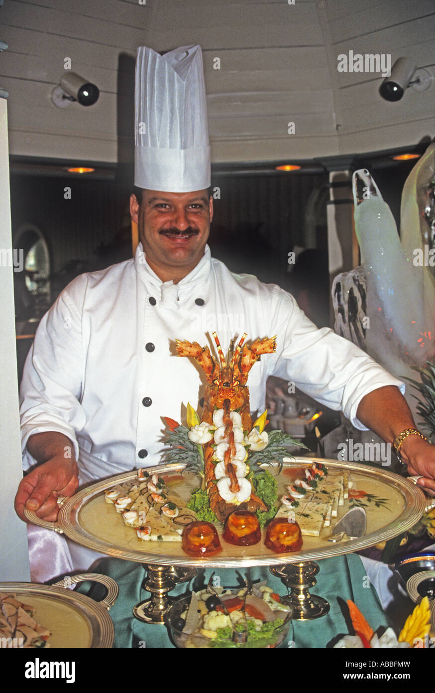 Bangkok chef in a luxury hotel proudly displaying exquisite seafood ...