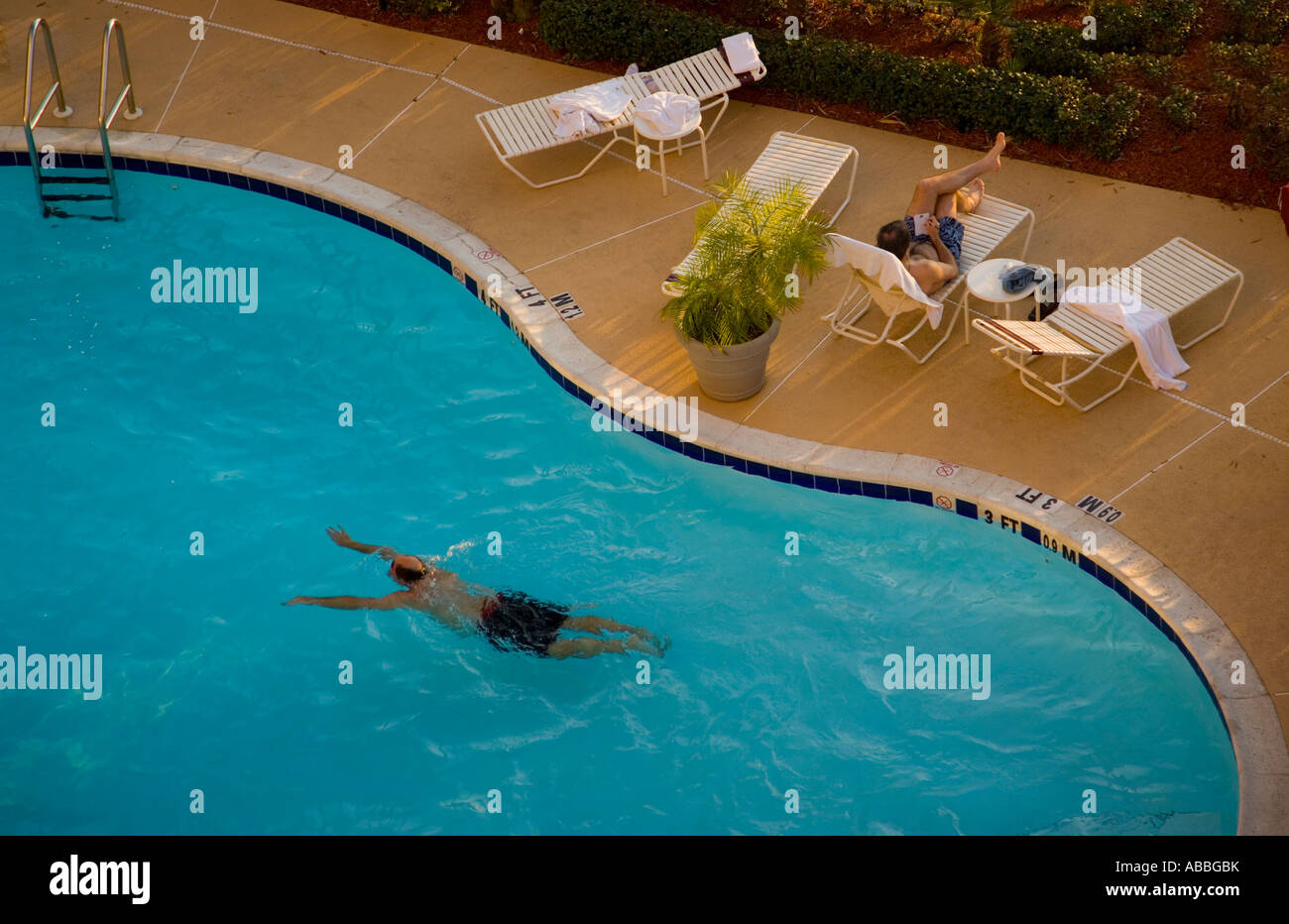 Bald man swimming Stock Photo - Alamy