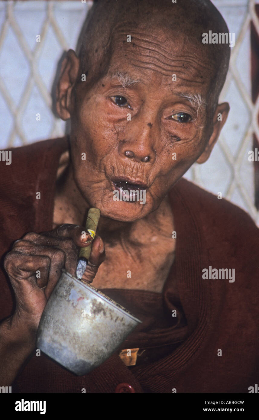 Burmese smoking monk at the Shwedagon Pagoda in Yangon ,Rangoon Stock ...