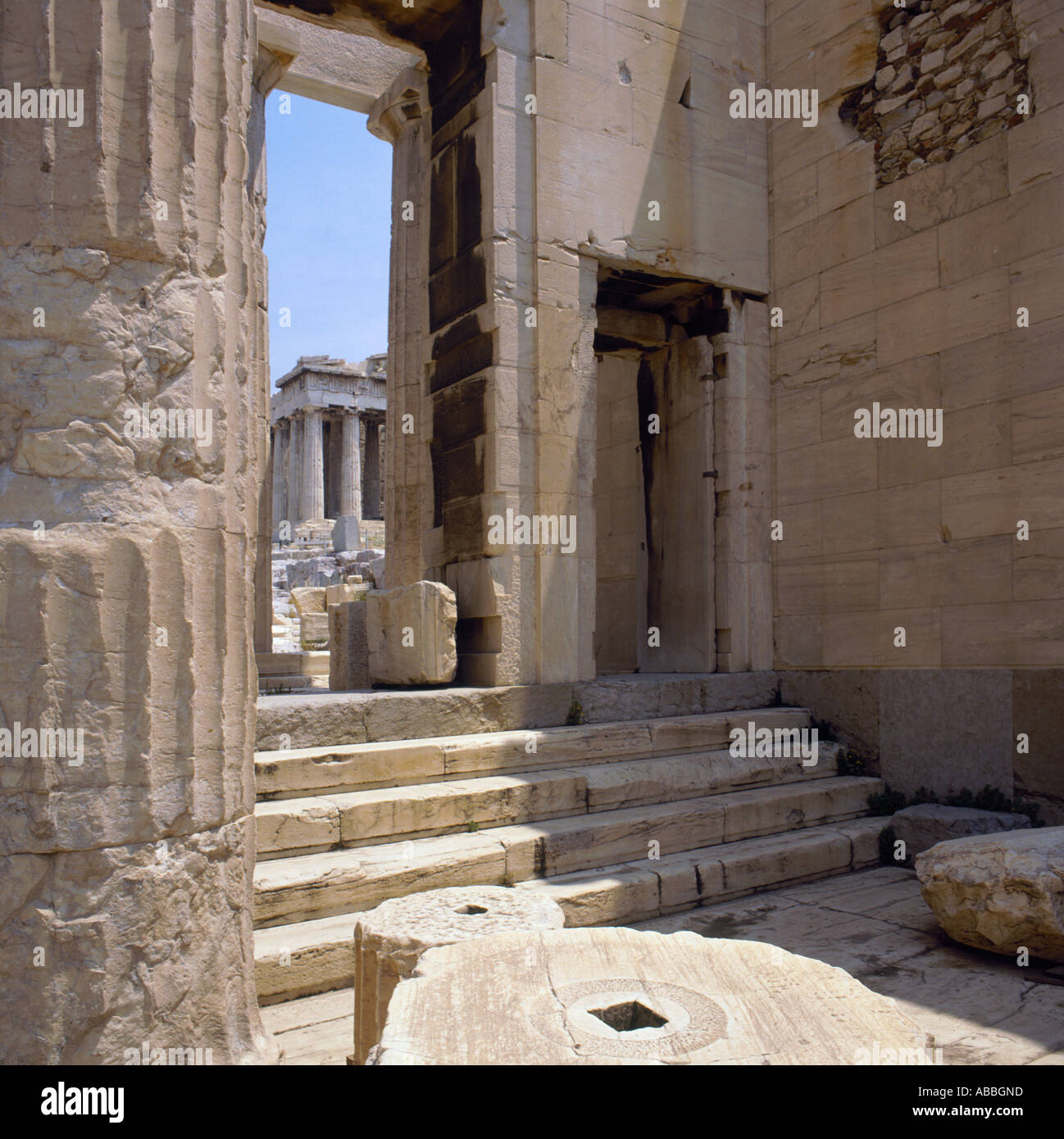 A corner of the Parthenon on the Acropolis viewed through a doorway and ...