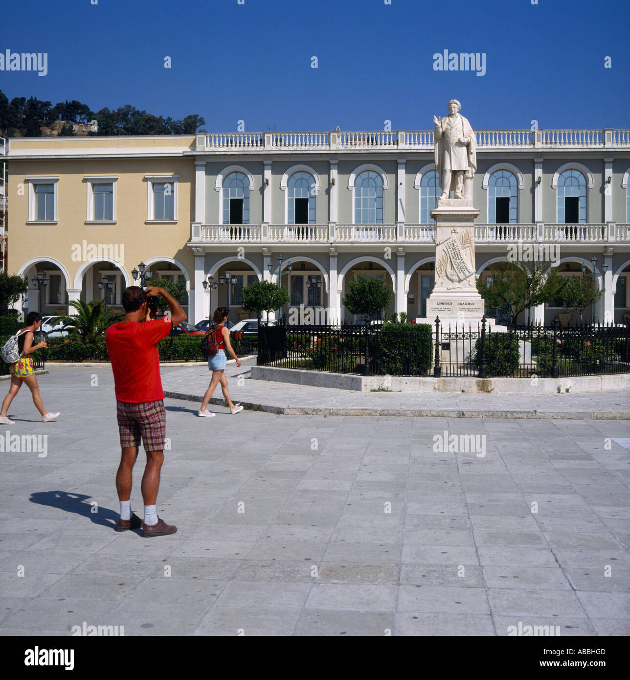 Tourist taking photo of statue of author Dionysios Solomos Zakynthos ...