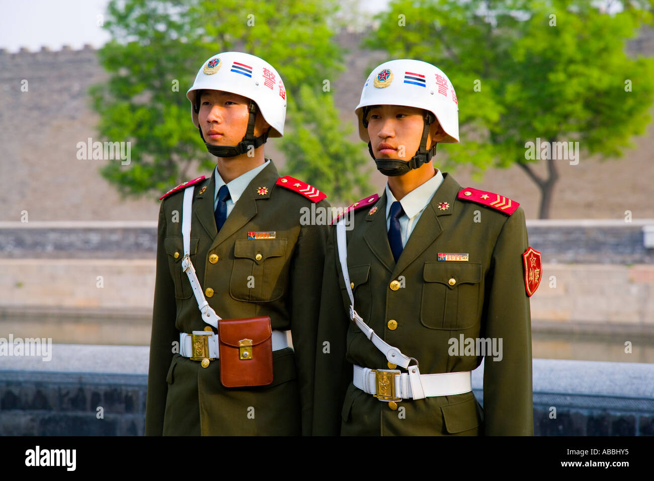 Soldiers of the People's Liberation Army stand to attention in ...