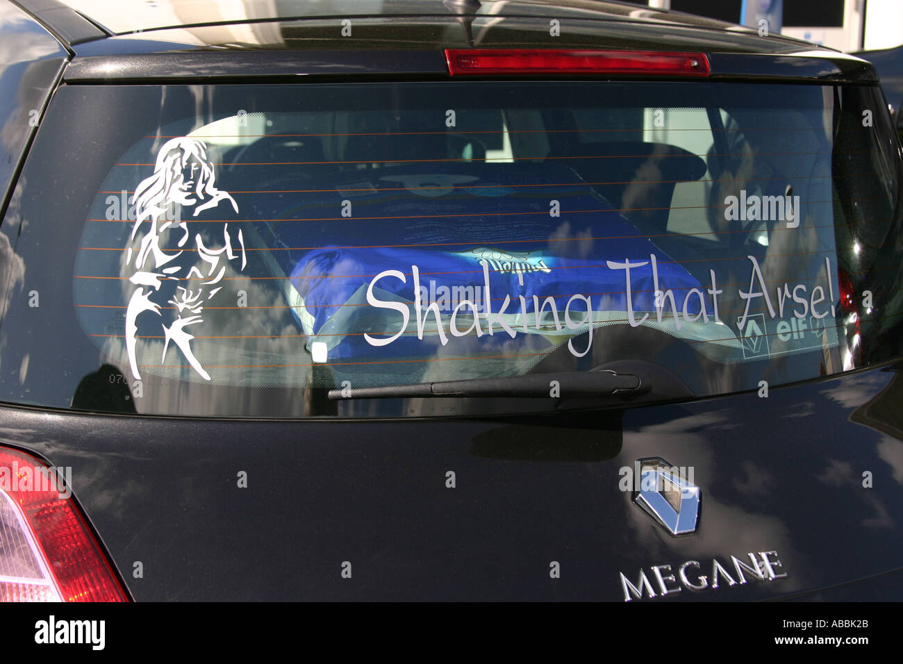 Shaking that arse advertisement in rear window of Renault Megane car in ...