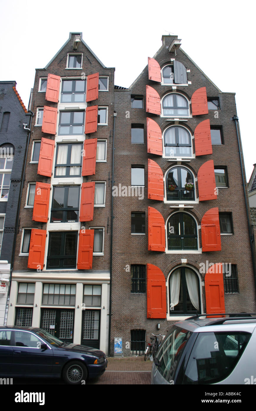Red window shutters on a building Amsterdam Netherlands Stock Photo - Alamy