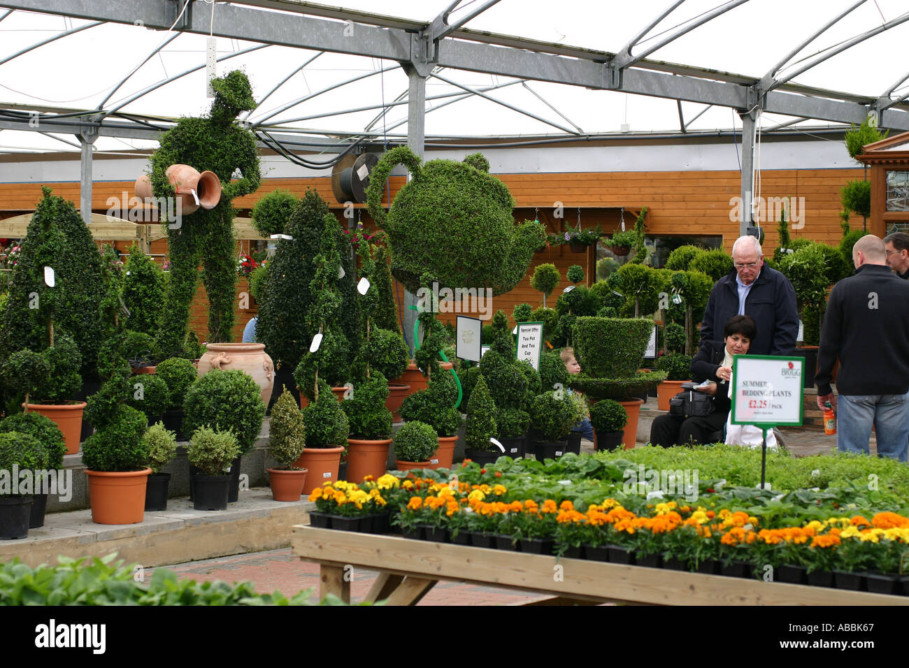 Topiary display in a garden center Stock Photo - Alamy