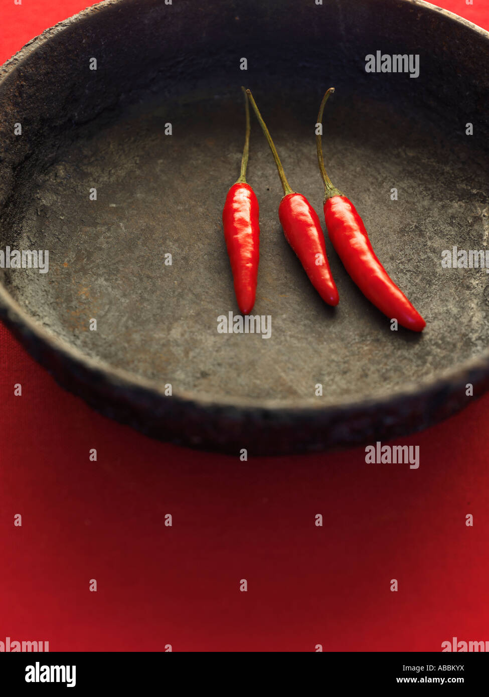 Three Red Chili Peppers Stock Photo - Alamy