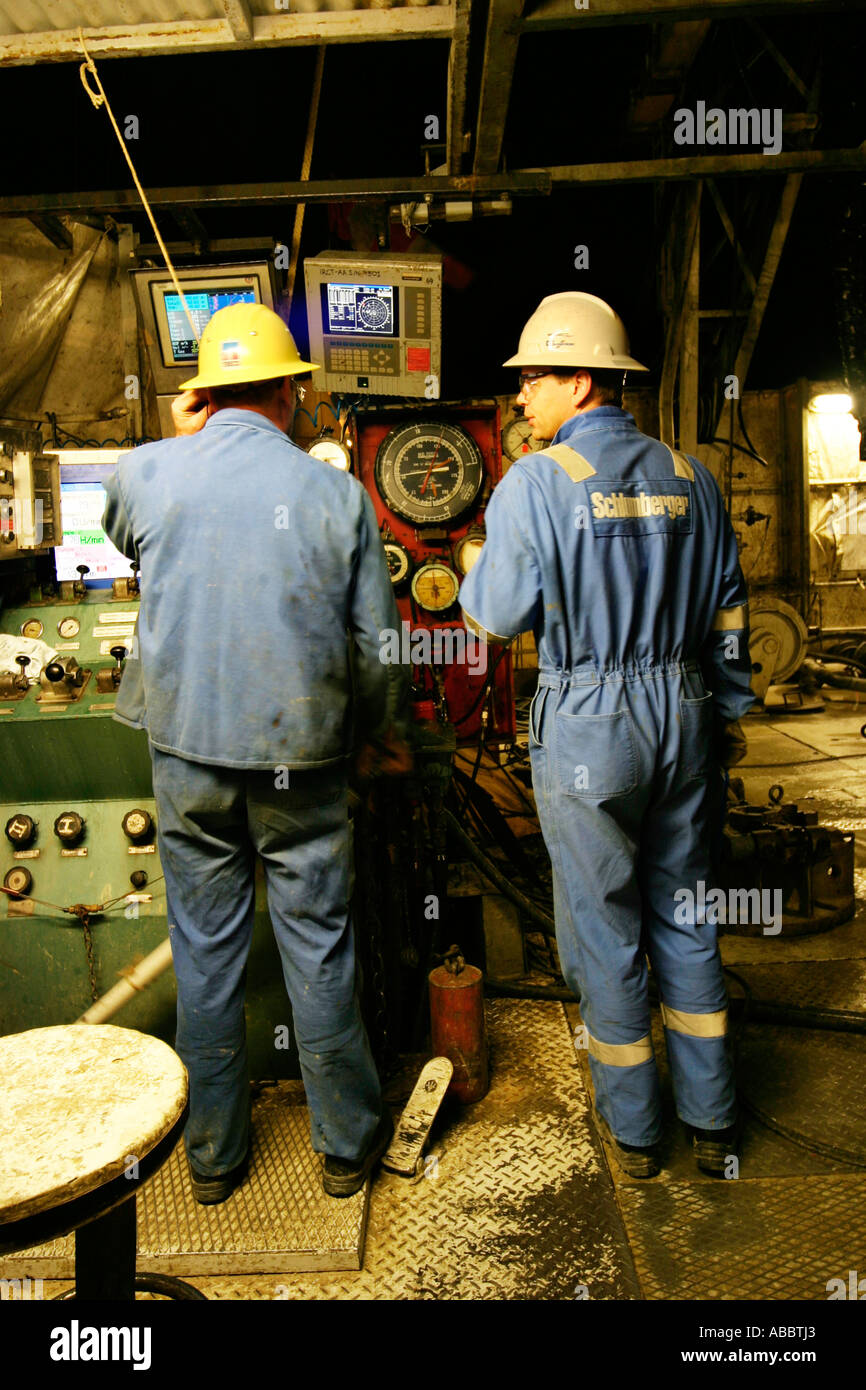 Worker with one drilling rig Stock Photo - Alamy