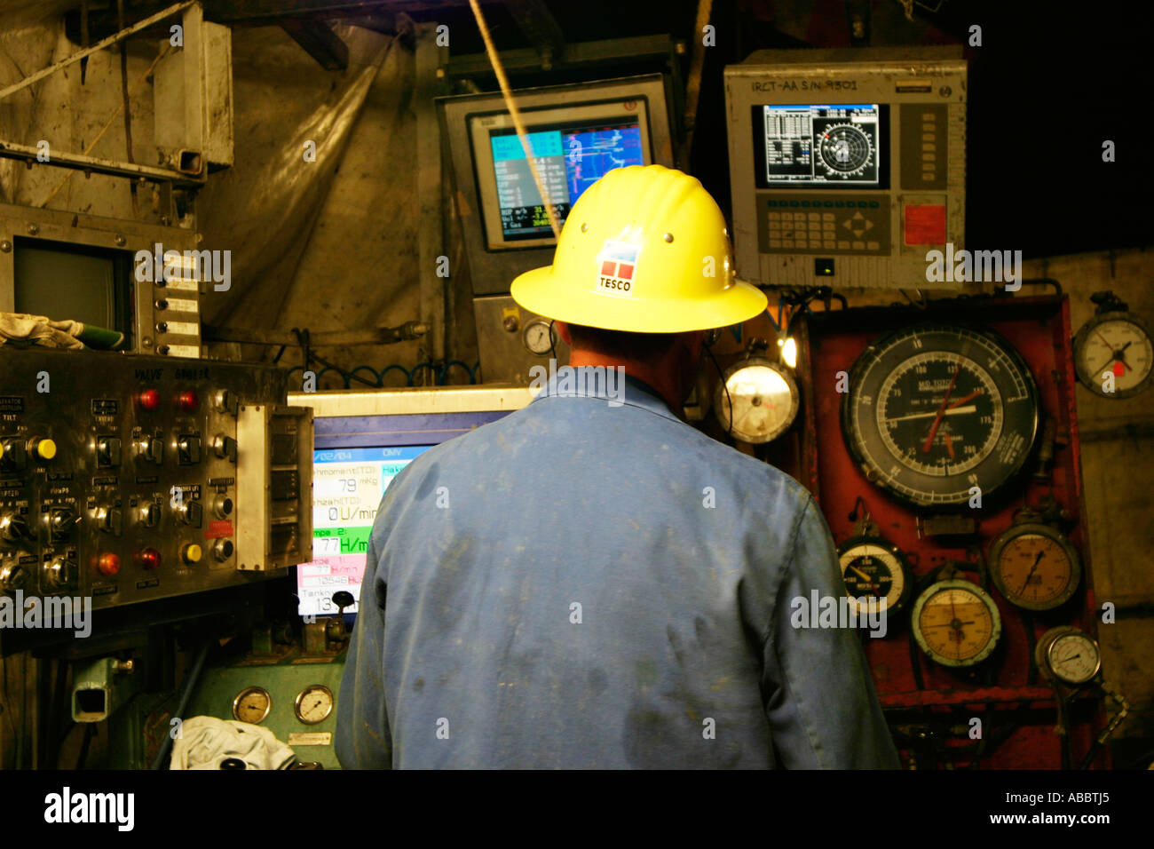 Worker with one drilling rig Stock Photo - Alamy