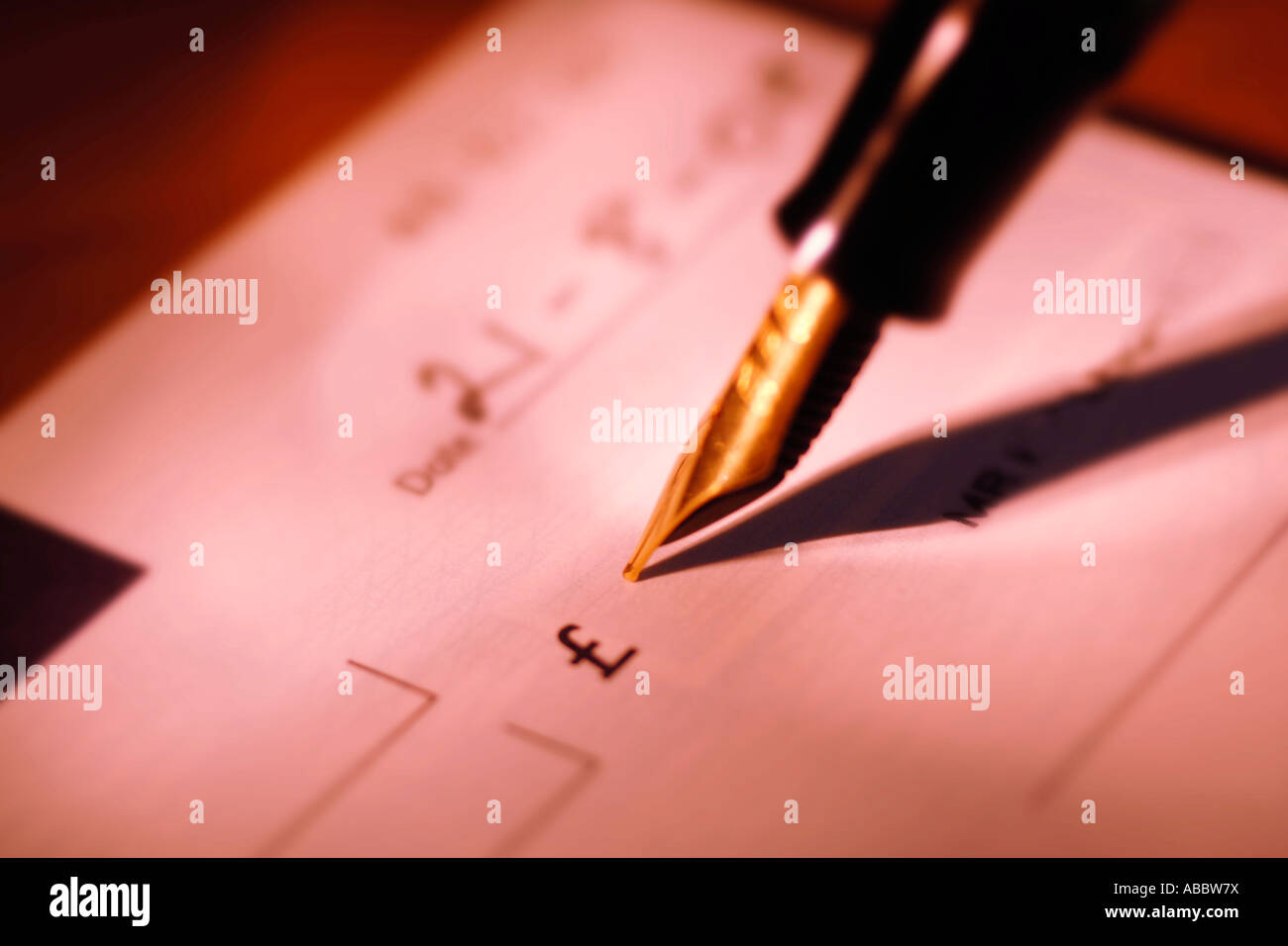 Person writing cheque Stock Photo - Alamy