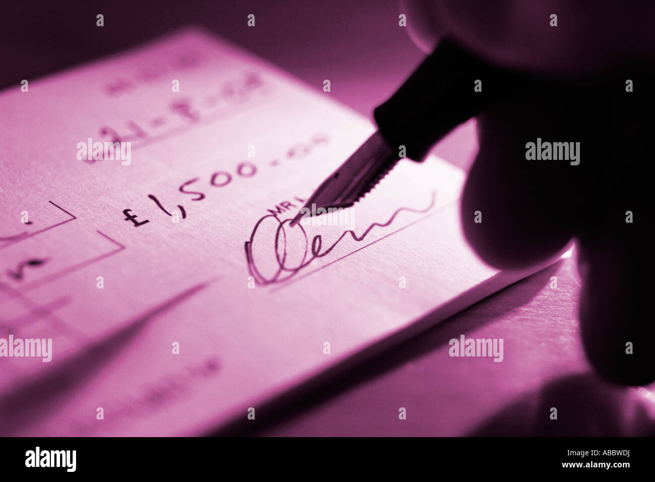 Person signing cheque Stock Photo - Alamy