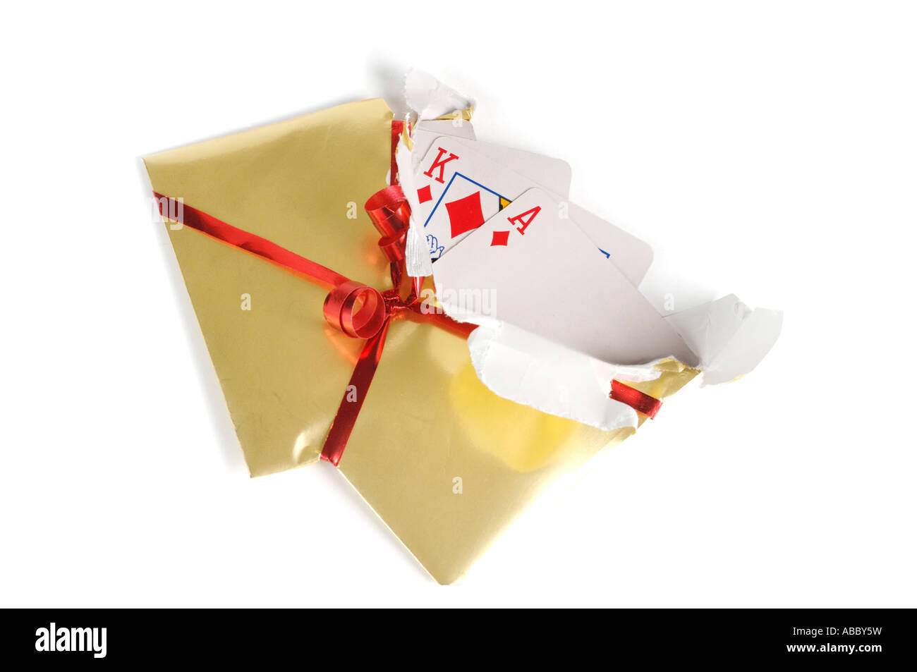 Gift wrapped hand of cards partially unwrapped showing Ace and King of ...